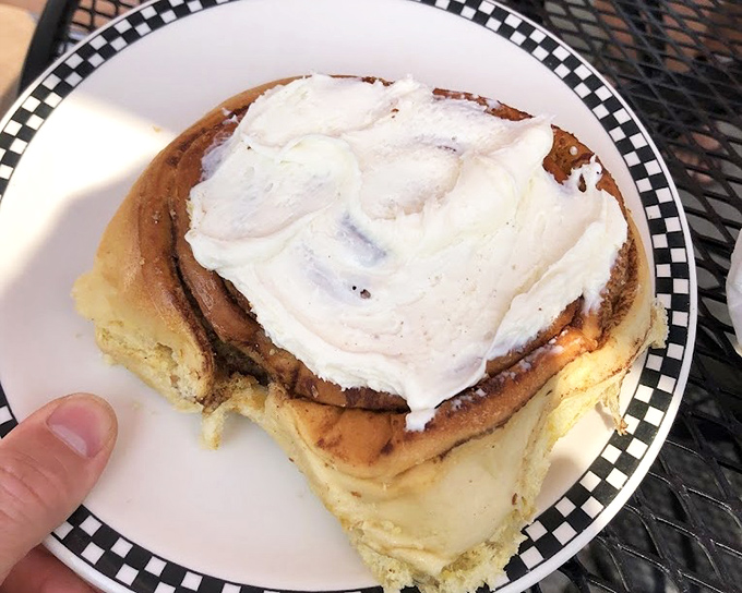 Not all heroes wear capes; some come on checkered plates with cream cheese frosting. This cinnamon roll has caused more joy than most Hollywood blockbusters.
