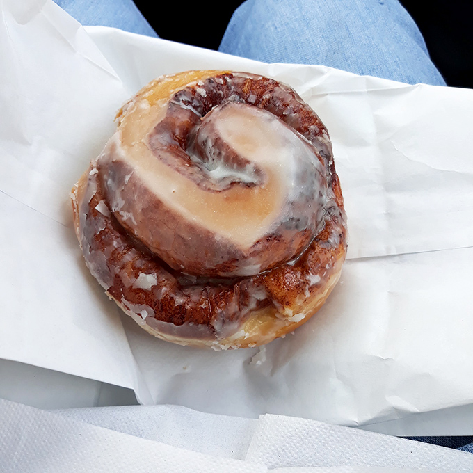 This isn't just a cinnamon roll&mdash;it's architecture in pastry form, with frosting cascading down spiral layers like a sugary waterfall of happiness.