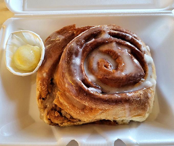Not just a cinnamon roll, but a spiral-bound love letter to butter and sugar that makes people drive across county lines before sunrise.