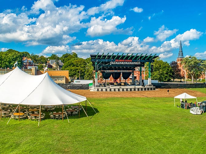 Summer in Jillson Square means concerts under Connecticut's impossibly blue skies, where lawn chairs become thrones and music flows freely.