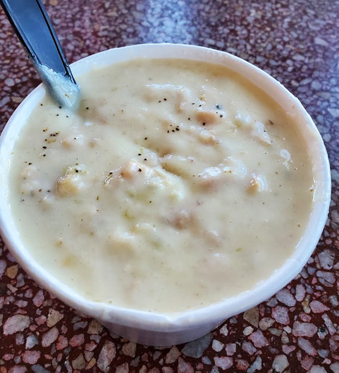 This bowl of clam chowder isn't just soup; it's a creamy ocean hug with tender clams and potatoes that might make New Englanders question their superiority complex.