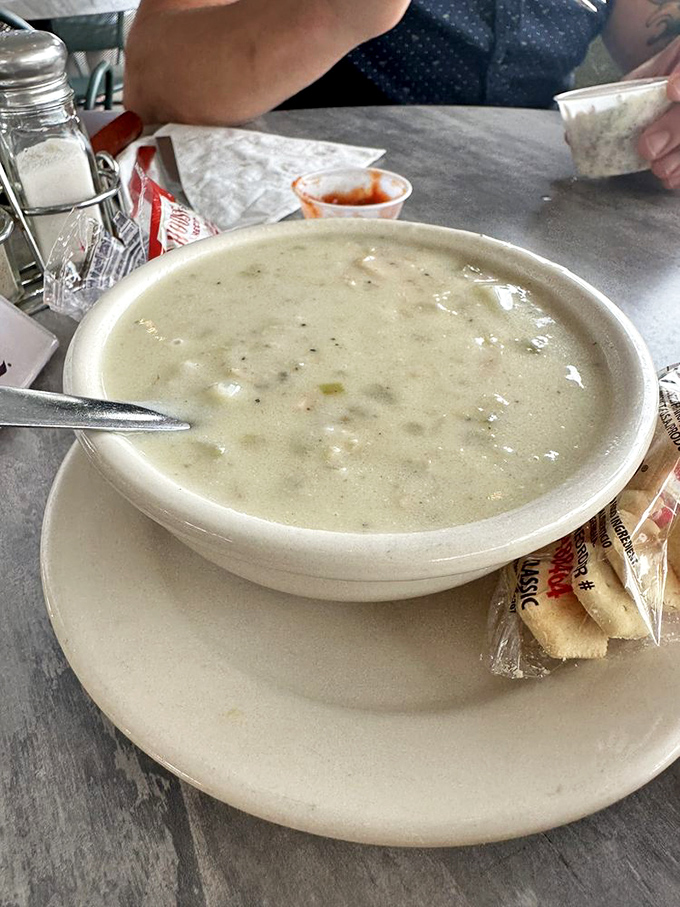 The clam chowder arrives like a creamy ocean poem in a bowl&mdash;each spoonful a perfect balance of briny clams and velvety comfort.