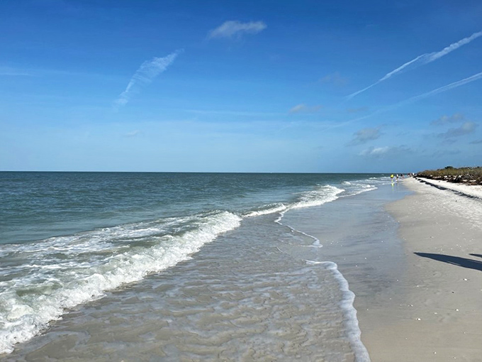 Gentle waves kiss the shoreline in an endless courtship. The kind of beach where your footprints might be the only ones you'll see for hours.