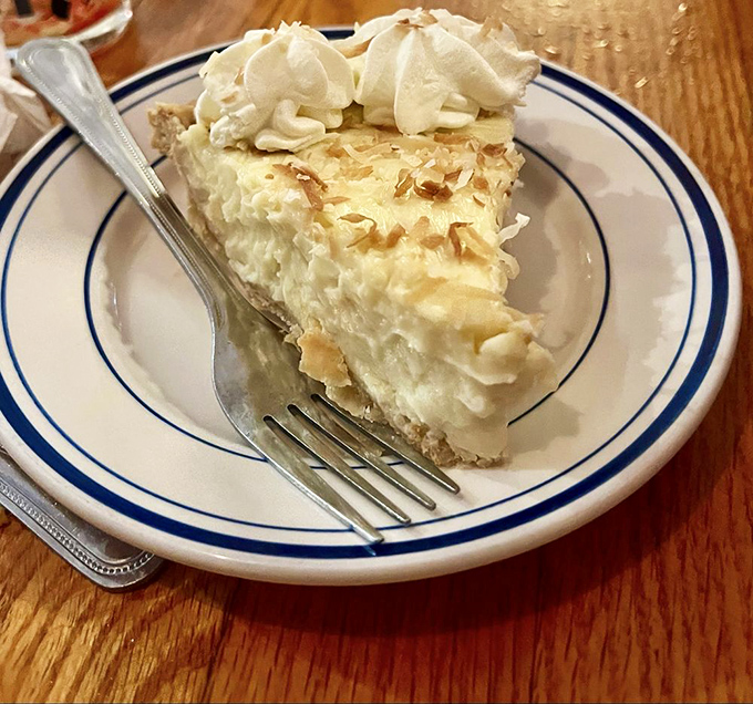 Coconut cream pie so heavenly it makes you wonder if clouds are actually made of whipped cream and toasted coconut flakes.