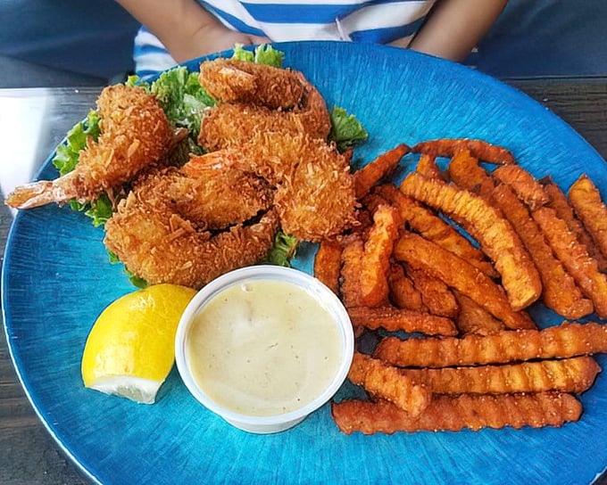 Golden coconut shrimp that crunch like nature's perfect potato chip, served with a sauce worth bottling and smuggling home.