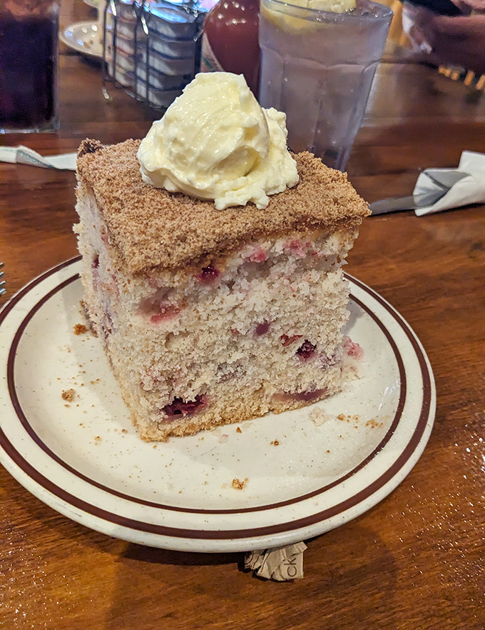 Behold the legendary blueberry coffee cake &ndash; a cinnamon-crowned masterpiece with a dollop of butter melting into its warm, berry-studded heart.