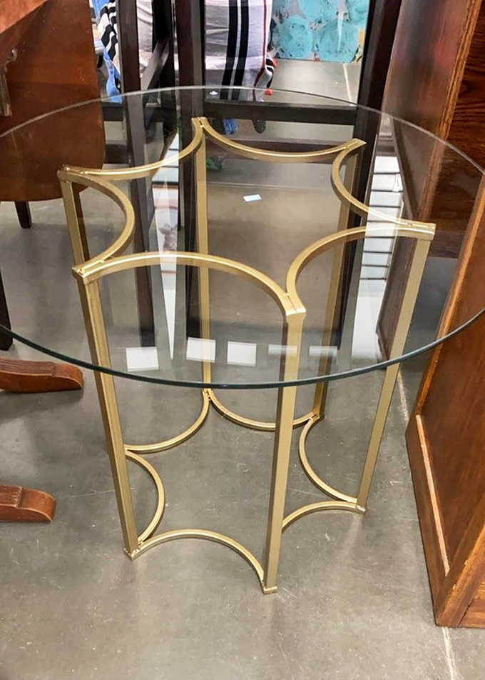 Mid-century modern meets contemporary chic in this gold and glass coffee table. Imagine the compliments when guests ask where you found this beauty.