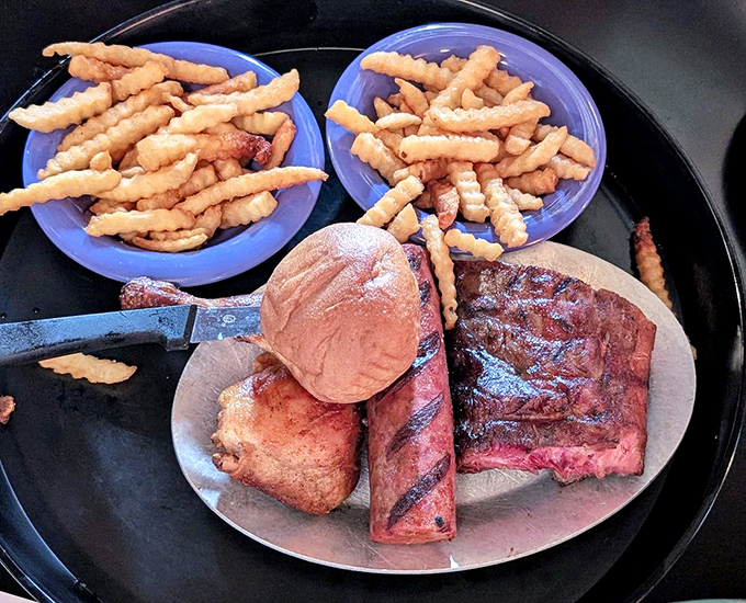 Barbecue's greatest hits album on a plate. That smoke ring on the ribs is like nature's seal of approval.