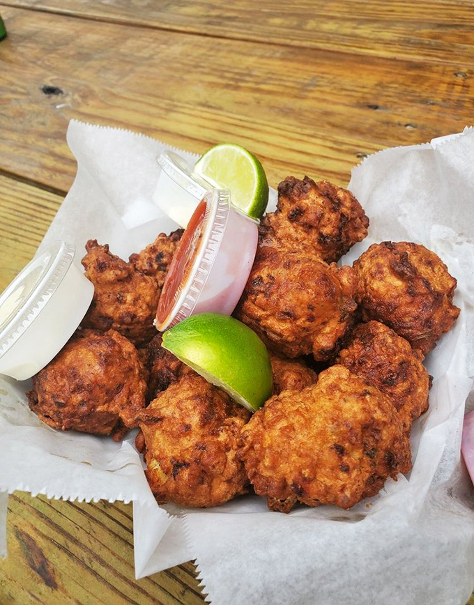 Golden orbs of conch perfection arrive with lime wedges that know their supporting role in this crispy symphony.