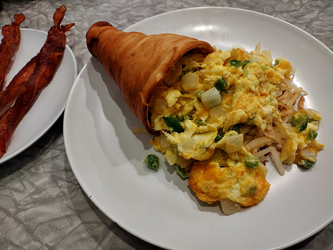 The Breakfast Conewich: Where scrambled eggs and veggies found their true calling inside a bread cone. Breakfast innovation at its finest!
