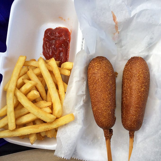 Two golden corn dogs paired with crispy fries &ndash; this is the kind of simple perfection that makes you wonder why anyone complicates food.