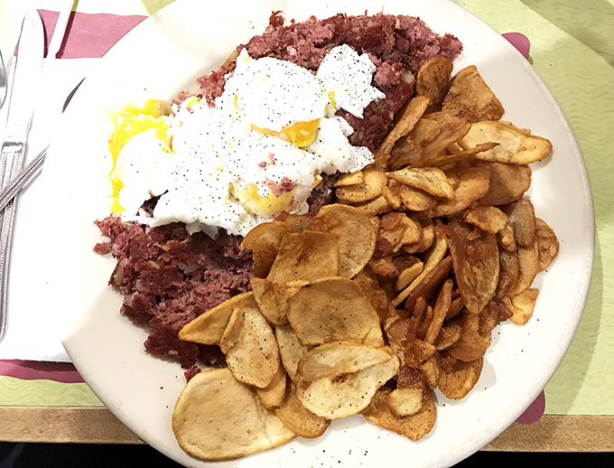 Corned beef hash with poached eggs and home fries that could make a vegetarian weep with temptation. This plate doesn't need a filter—just your undivided attention.