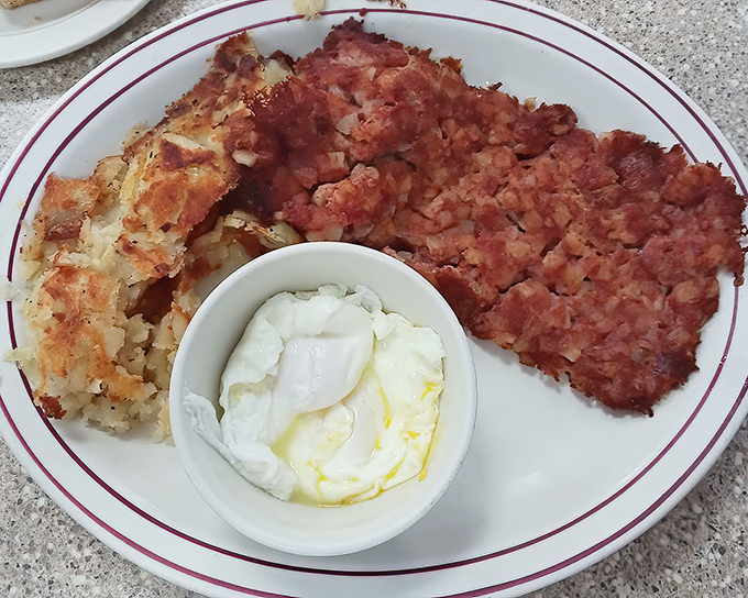 Corned beef hash with the perfect crisp-to-tender ratio and eggs that belong in the breakfast hall of fame. This plate doesn't gamble with flavor.