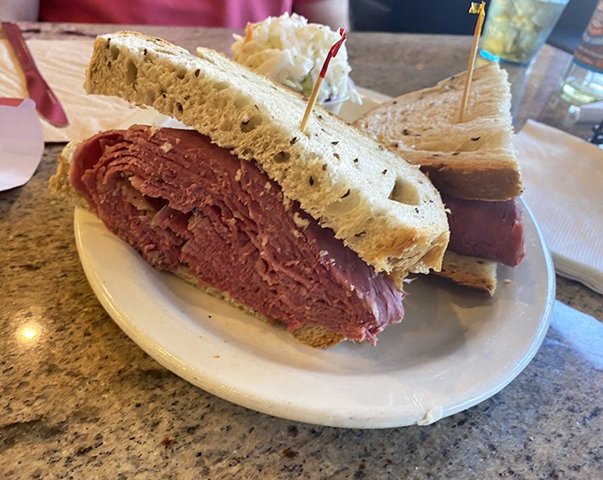 Behold the star attraction: a corned beef sandwich so generously stacked it requires engineering skills just to take the first bite.