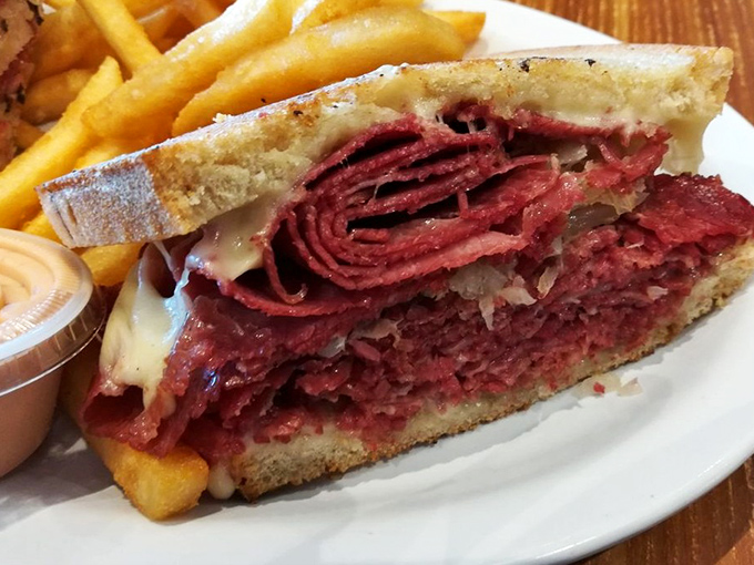 Behold the star of the show&mdash;a corned beef sandwich so perfect it deserves its own ZIP code. Thinly sliced, perfectly stacked, and flanked by golden fries.