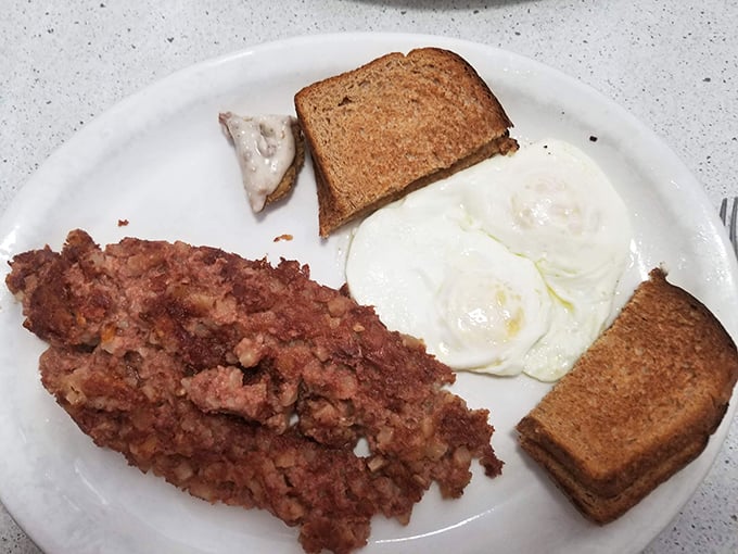 Corned beef hash with perfectly cooked eggs and toast &ndash; the breakfast trinity that's been solving life's problems since your grandparents' first date.