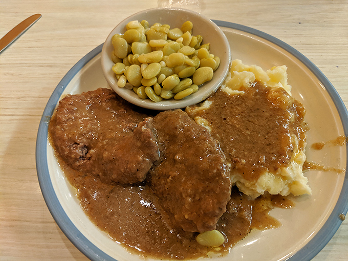 Country style steak that falls apart at the mere suggestion of your fork, swimming in gravy that should be bottled and sold as liquid comfort.