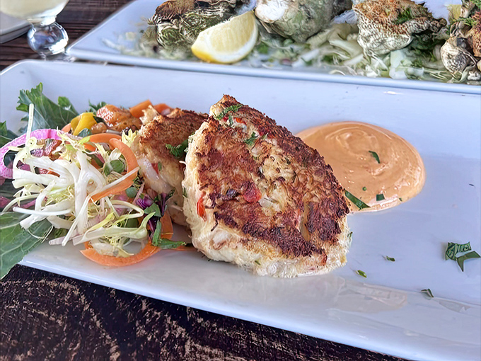 The star of the show: a golden-brown crab cake that's more crab than cake, served with a tangy remoulade that'll make you consider drinking it straight.