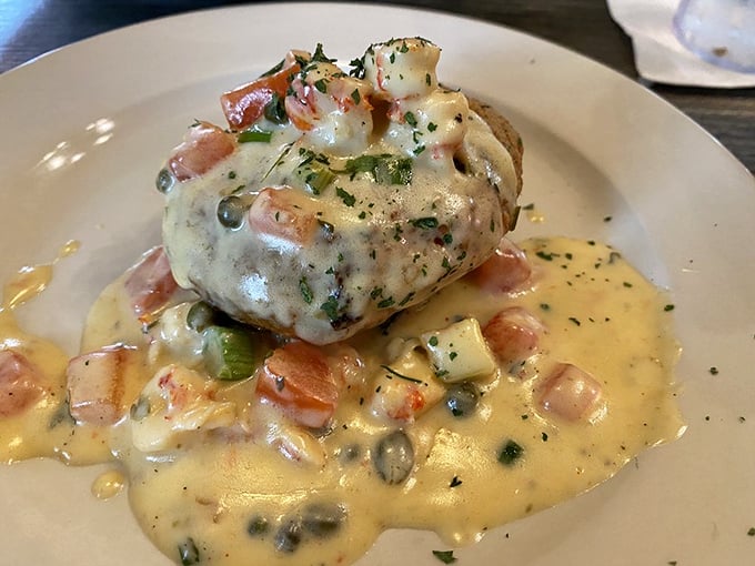 Behold the crab cake that launched a thousand road trips &ndash; swimming in a buttery sauce that you'll be tempted to drink when nobody's looking. 