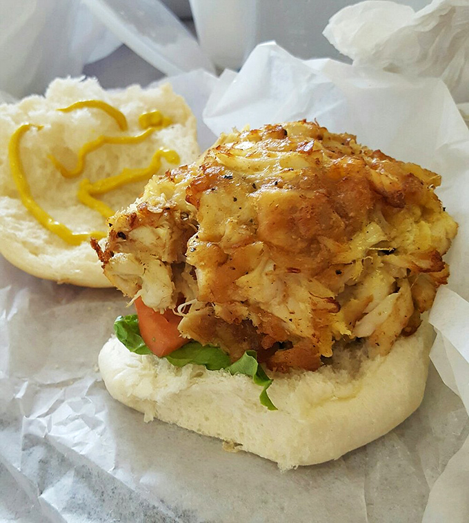 Behold the holy grail of crab cakes&mdash;golden-crusted, barely bound together by kitchen magic. This sandwich doesn't need fancy plating to change your life.