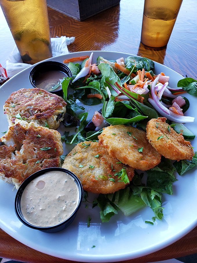 These aren't just crab cakes; they're edible evidence that sometimes the simplest pleasures &ndash; golden-brown perfection with minimal filler &ndash; are life's greatest luxuries.