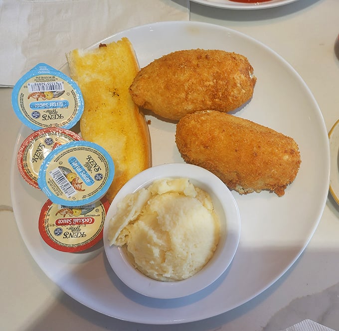 Golden-brown crab cakes that could make Maryland jealous, served with creamy mashed potatoes that whisper, "Take a nap after this."
