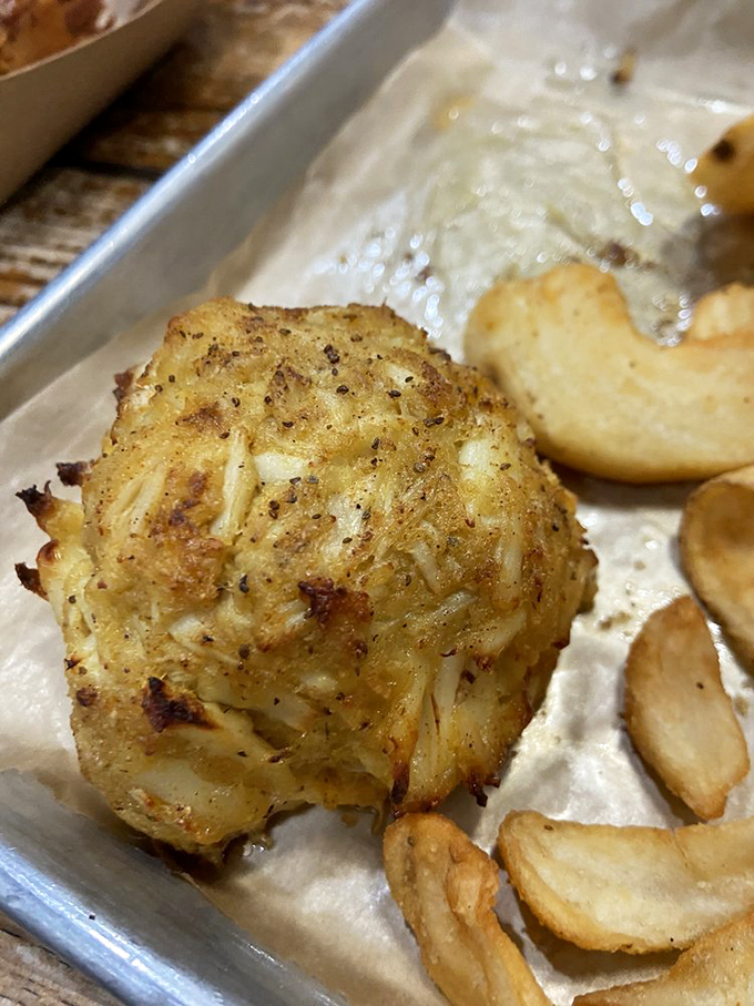 Golden-brown perfection! This crab cake is what dreams are made of&mdash;mostly crab, minimal filler, and seasoned just enough to make your taste buds do a happy dance.