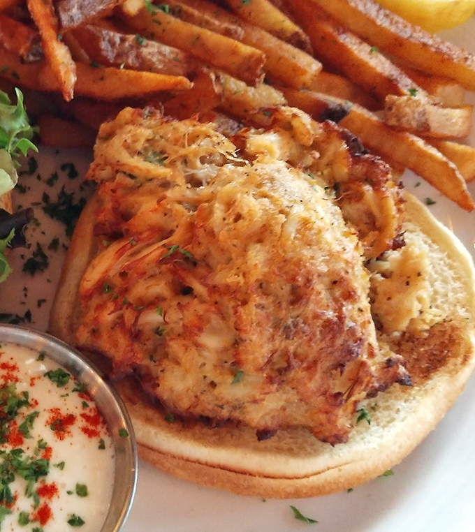 This crab cake doesn't just sit on the plate&mdash;it commands attention. Golden-brown perfection with a side of "where have you been all my life?"