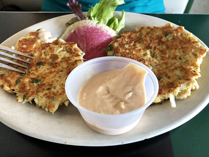 Golden-brown perfection that would make Maryland jealous. These crab cakes deliver that magical ratio of jumbo lump meat to minimal filler that seafood dreams are made of.