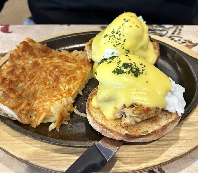 Behold: eggs Benedict perfection. That hollandaise sauce drapes over those poached eggs like a golden blanket of breakfast luxury.