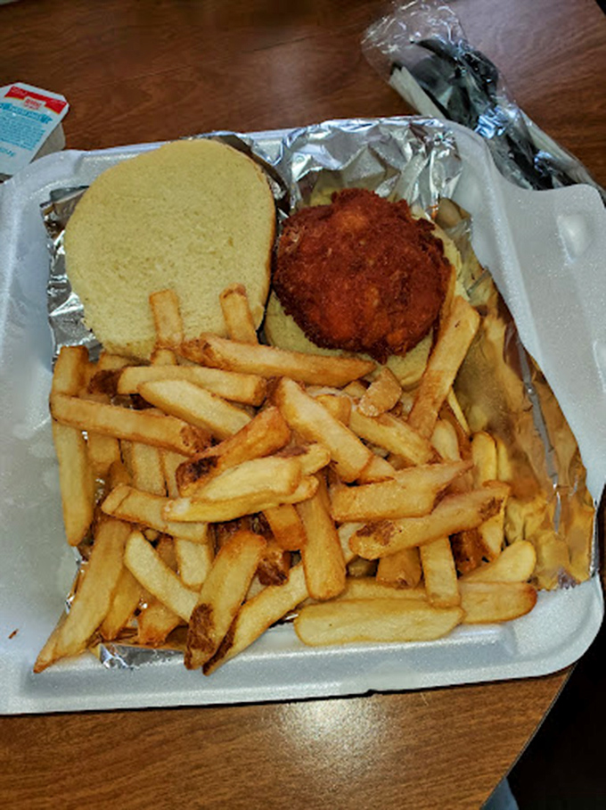 This isn't just a crab cake sandwich &ndash; it's Maryland's soul on a bun, golden-brown and packed with more crab than binding.