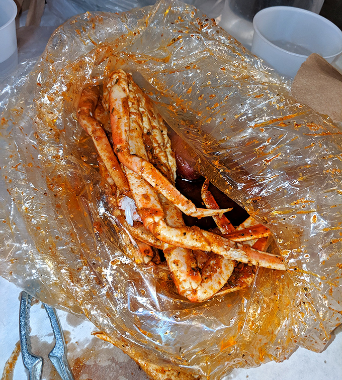 These crab legs arrive dressed in garlic butter glory, ready for their starring role in your dinner theater.