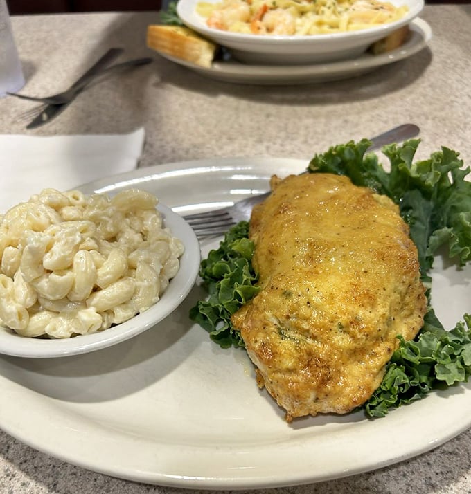 The star of the show: a golden-brown crab cake that's more crab than cake, nestled beside creamy mac and cheese. Delaware on a plate.