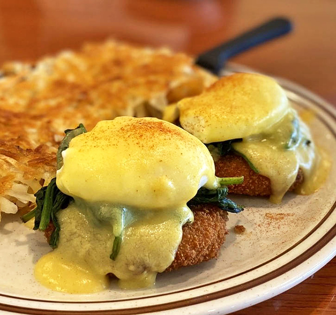 Behold the star attraction: golden crab cakes crowned with poached eggs and draped in hollandaise&mdash;breakfast architecture at its finest.