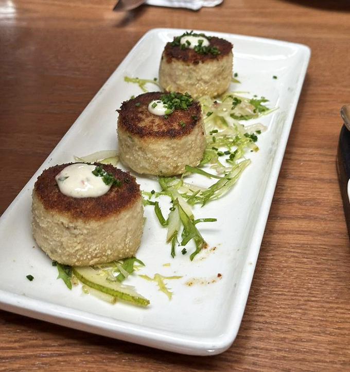These golden-brown crab cakes aren't just appetizers, they're the reason some Washingtonians set their GPS to Tacoma on weekends.