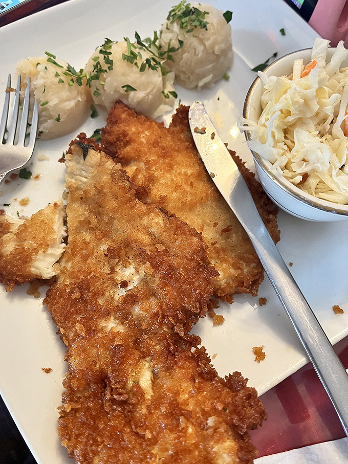 Behold the golden-crusted champion: a pork chop so perfectly fried it deserves its own fan club and possibly a parade.