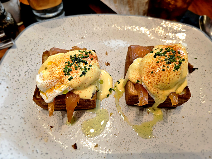 Behold the star of our show: the Croissant Benedict. Those perfectly poached eggs perched on buttery croissants are about to trigger a symphony of flavor that Mozart would envy.