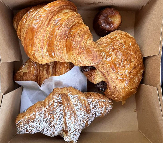 A box of croissants that would make a Parisian weep with joy. The golden layers practically whisper "bonjour" with each buttery, flaky bite.