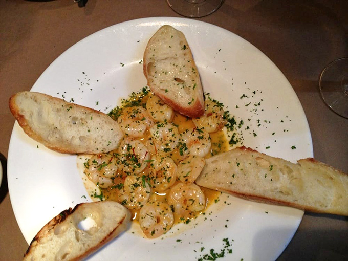 The legendary Cuban shrimp arrive like edible sunshine, bathed in saffron-garlic butter that demands to be sopped up with every last morsel of ciabatta.