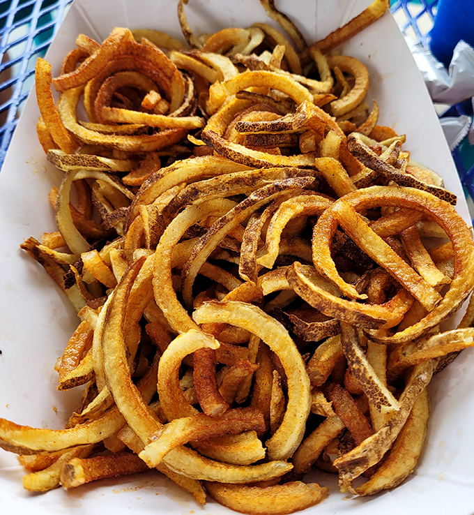 Golden spirals of potato perfection! These aren't just curly fries; they're crispy, seasoned works of art that put ordinary french fries to shame.
