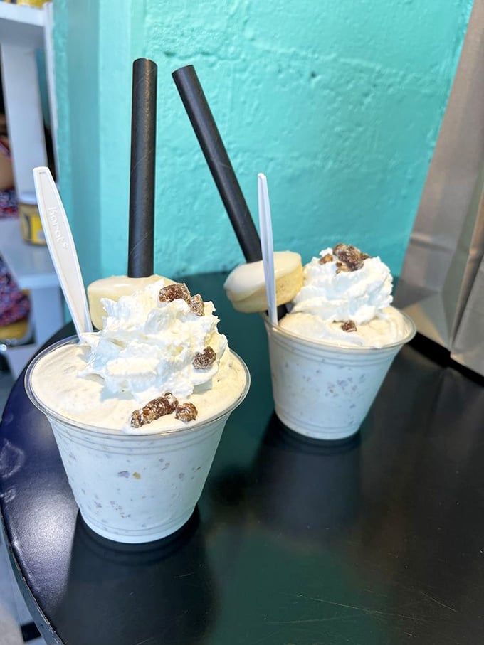 Two date shakes stand at attention, their creamy perfection topped with whipped cream and date pieces&mdash;the desert's answer to liquid gold.