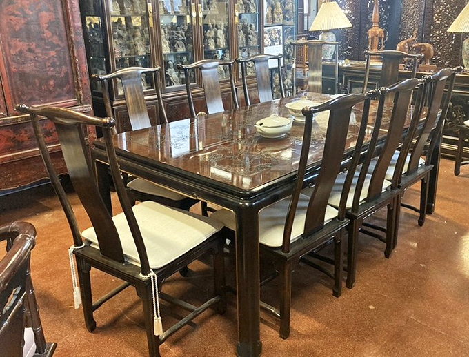 Dinner parties of yesteryear happened around tables like this elegant Asian-inspired dining set. Can't you just hear the clinking glasses?