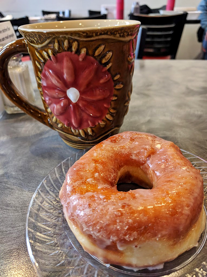 That glazed donut isn't just breakfast—it's edible poetry. Paired with coffee in a mug that could tell stories, this is how Pennsylvania mornings were meant to begin.