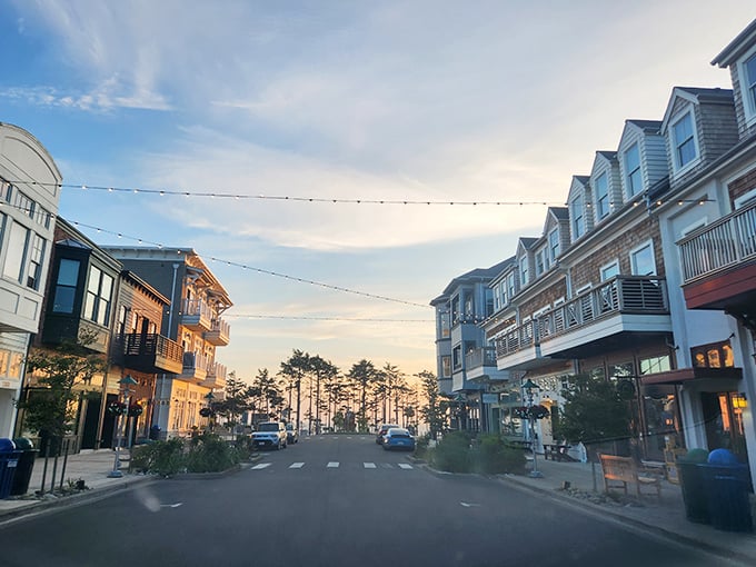 Main Street magic at sunset. String lights stand ready for evening ambiance as Seabrook's pedestrian-friendly downtown invites twilight strolls between shops and restaurants.