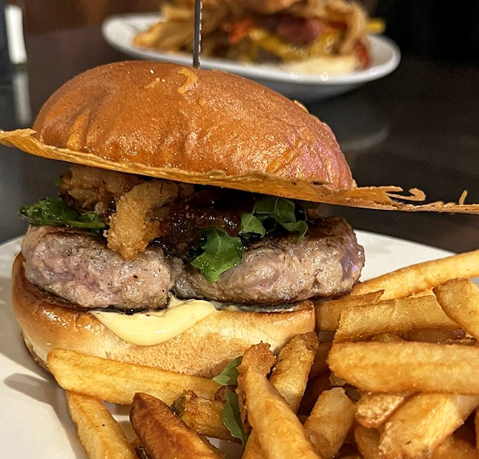 Behold the legendary Duck Burger in all its glory. That pear fig jam and those crispy onions aren't just toppings&mdash;they're game changers.