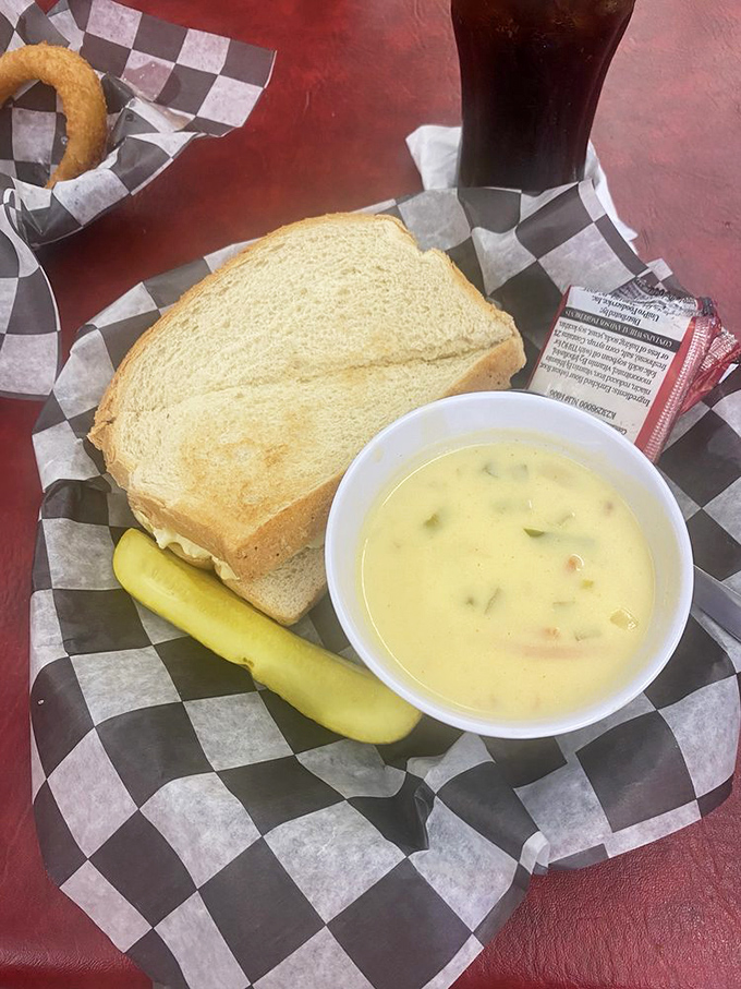 A perfect trifecta: egg salad sandwich, pickle spear, and homemade soup. Lunch doesn't get more honest than this.