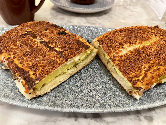 This Jerusalem bagel sandwich isn't just breakfast, it's an epiphany &ndash; sesame-crusted perfection cradling eggs and cheese with za'atar's aromatic embrace.