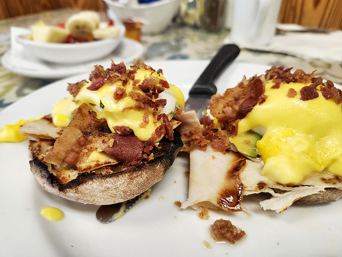 Eggs Benedict perfection – those golden yolks ready to cascade over Canadian bacon like a sunrise breaking through morning clouds.