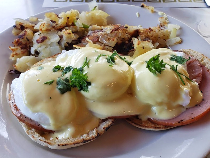 Behold the crown jewel: Eggs Benedict with perfectly poached eggs and hollandaise that cascades like a golden waterfall. Breakfast royalty, indeed.
