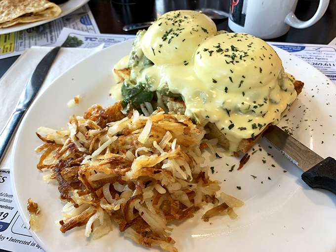 Eggs Benedict that would make a food photographer weep with joy. Those crispy hash browns aren't just a side dish&mdash;they're the supporting actor who steals the scene.